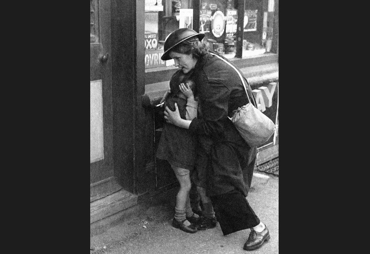 British air raid warden Mary Couchman shields three children (including ...