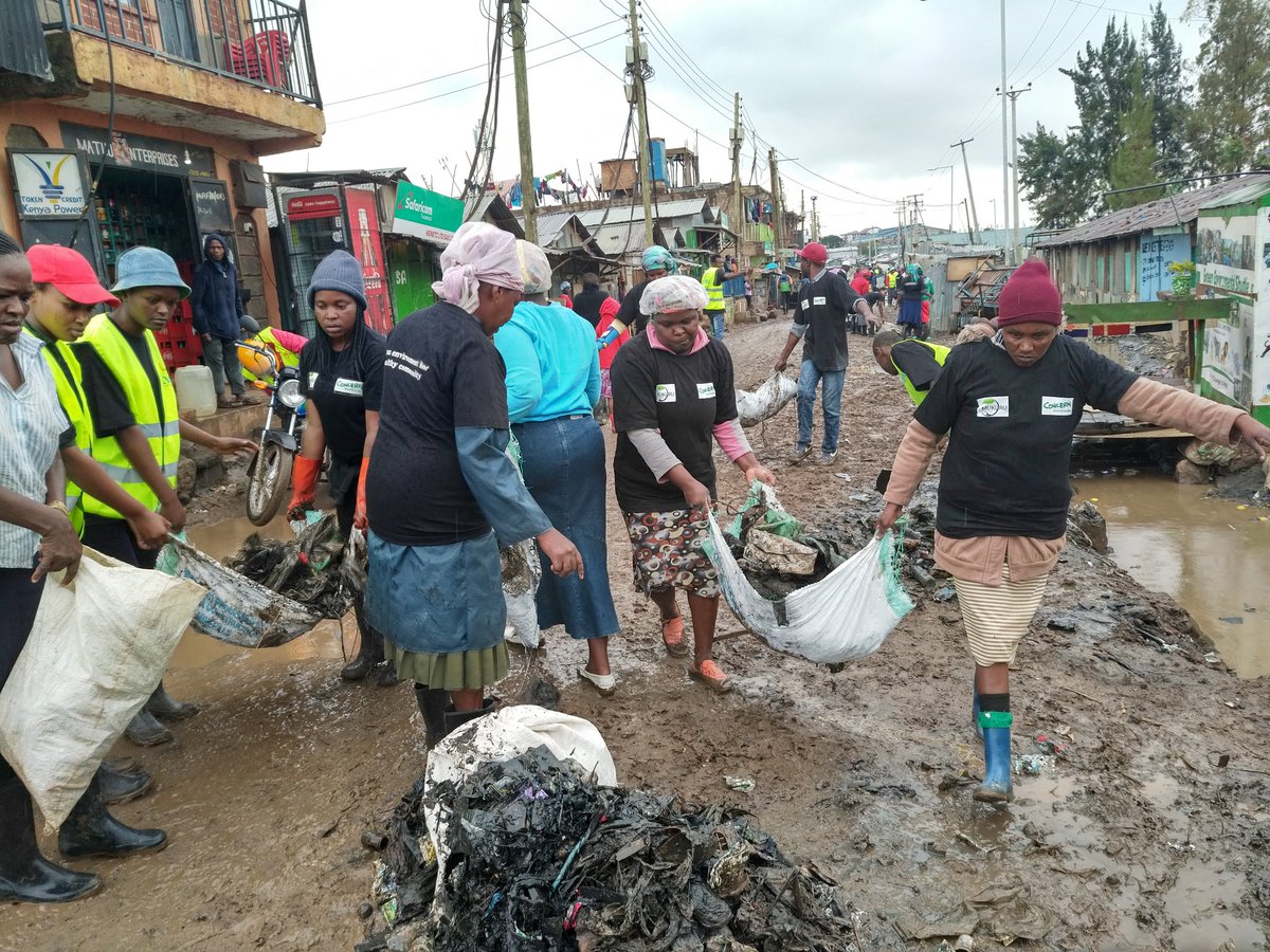 People Cleaning The Environment