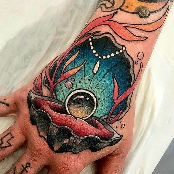 Seashell With Pearl Tattoo