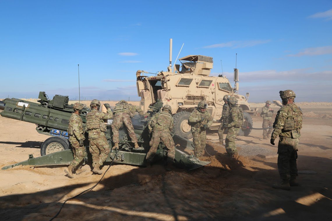 CENTCOM Command Sgt. Maj. William F. Thetford, presents coins to U. S ...