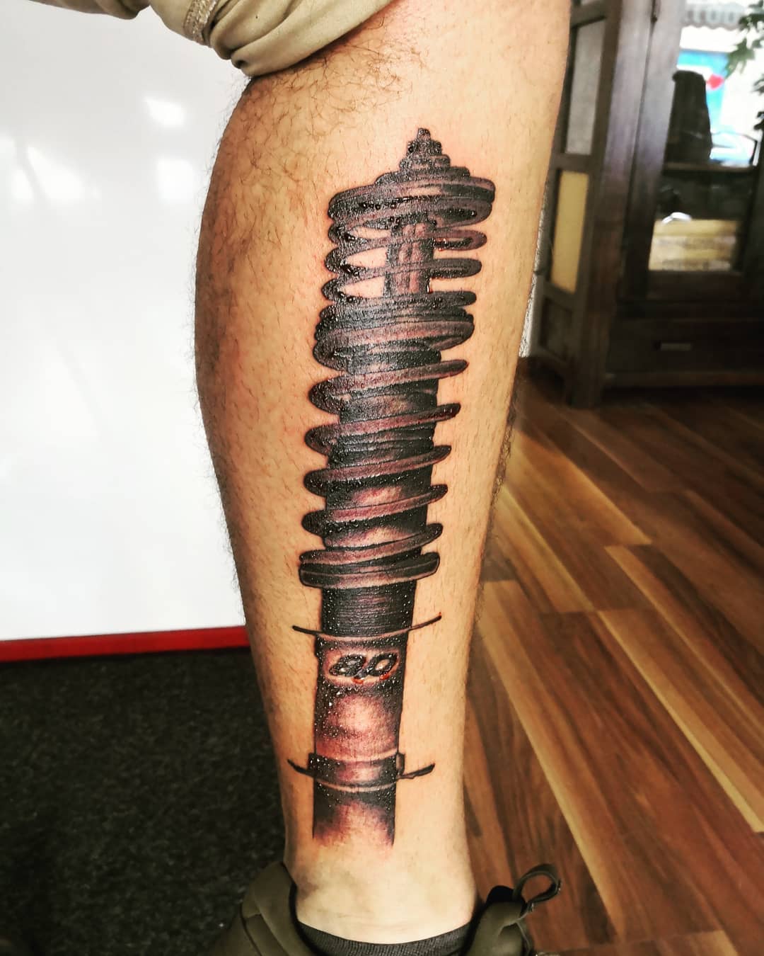 Coil Spring Leg Tattoos