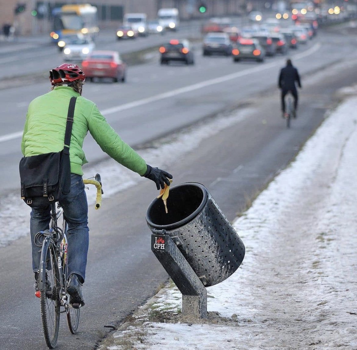 Trash can next to a bicycle road. You can throw your trash out without ...