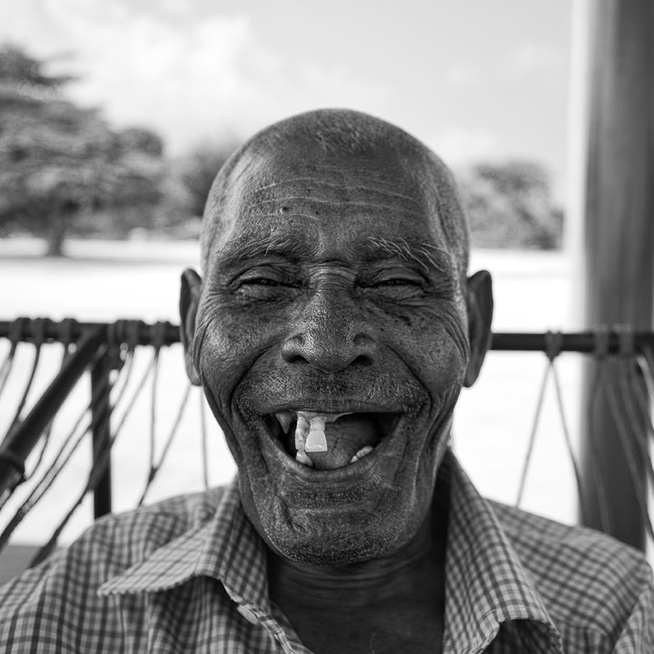 Black Man Smiling With No Teeth
