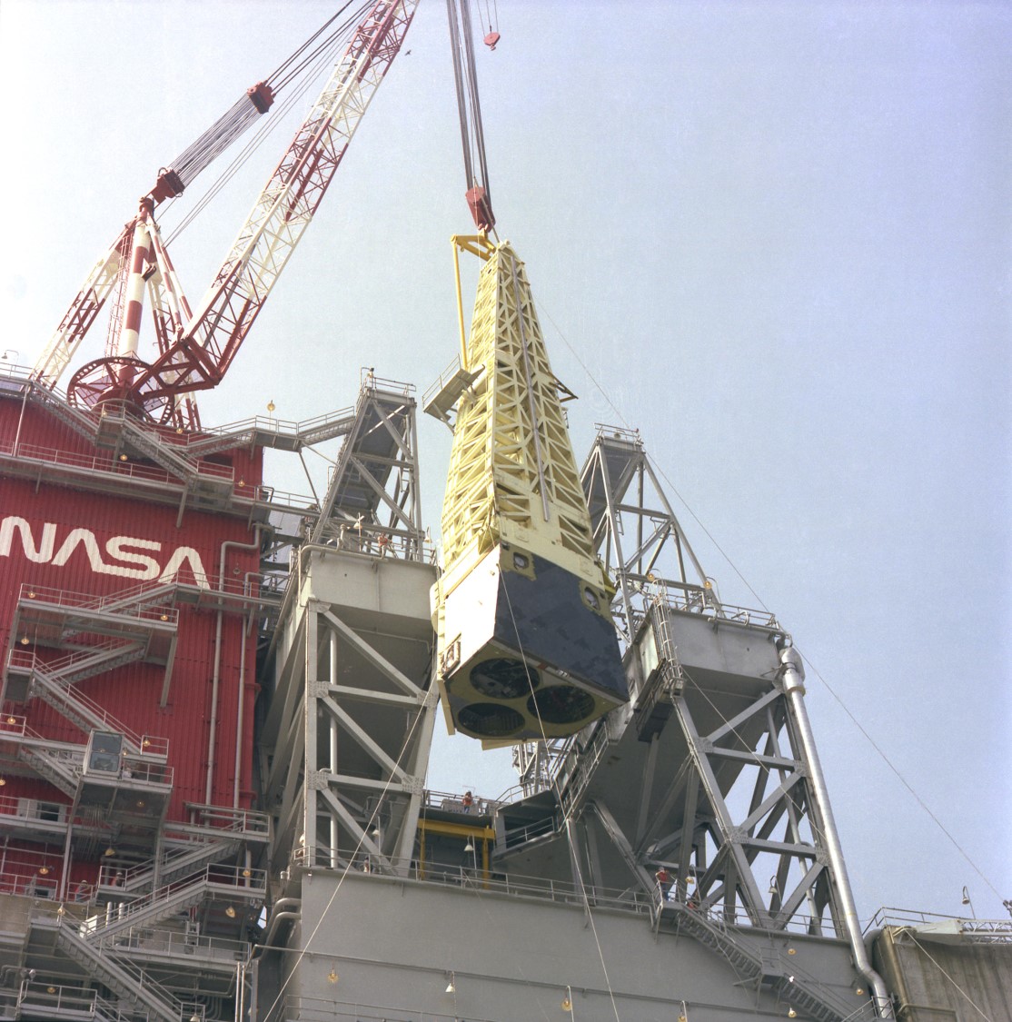 A space shuttle main propulsion test article (MPTA) component is lifted ...