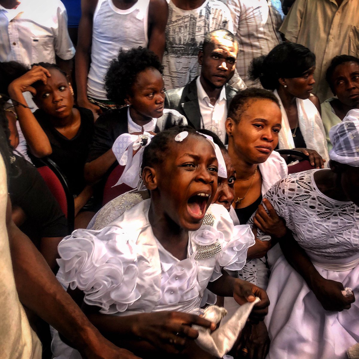 People Crying At A Funeral