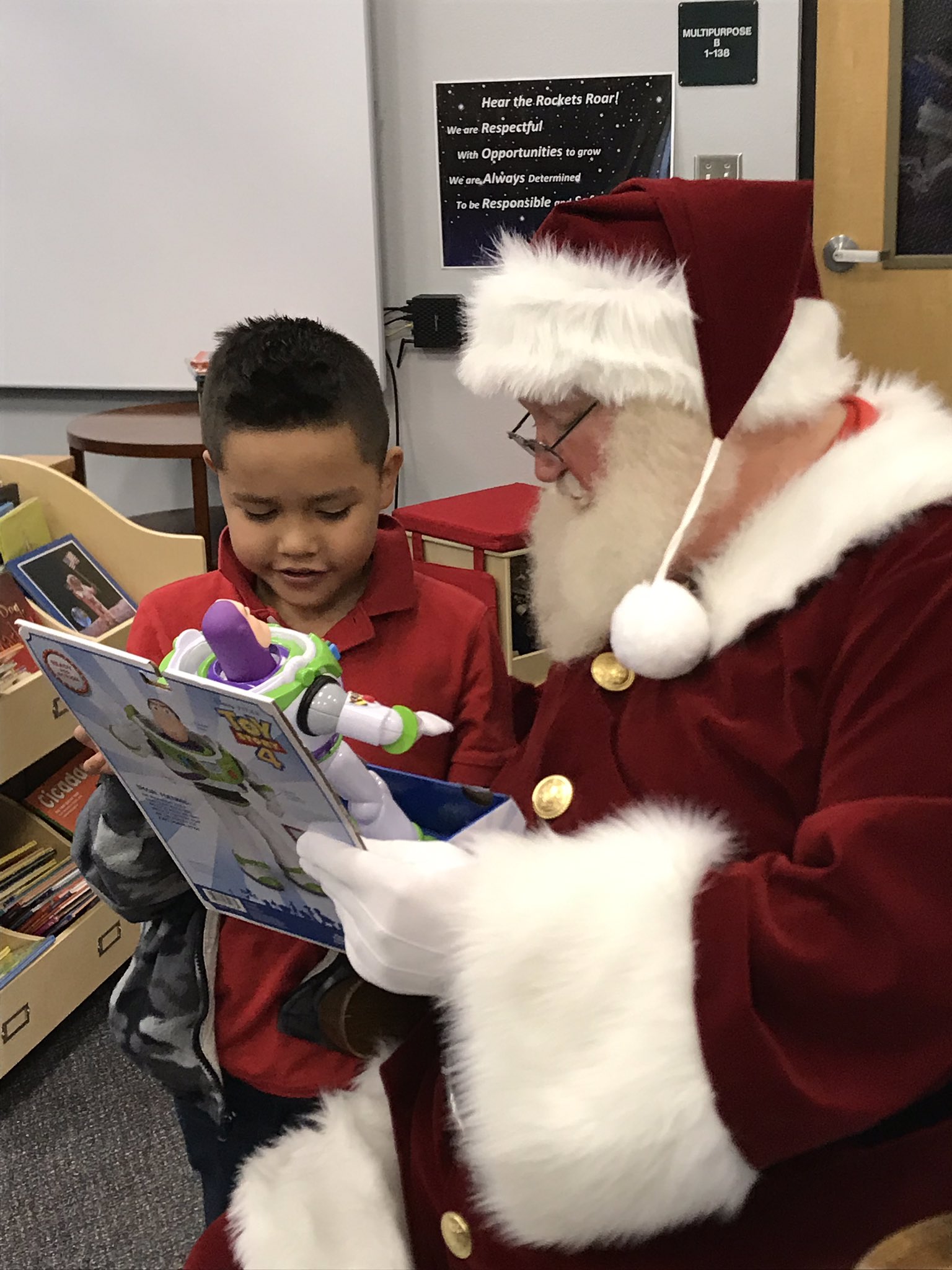 Santa Reading A Book To Children