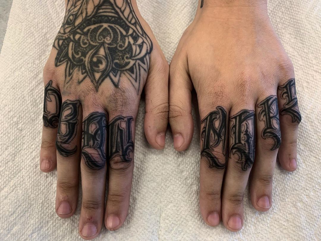 Script Knuckle Tattoos