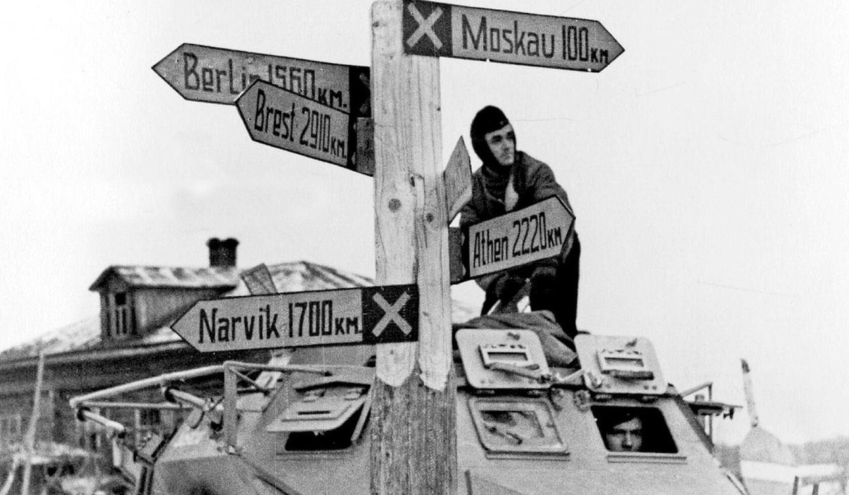 100km from Moscow, a German soldier proudly installs a signpost showing ...