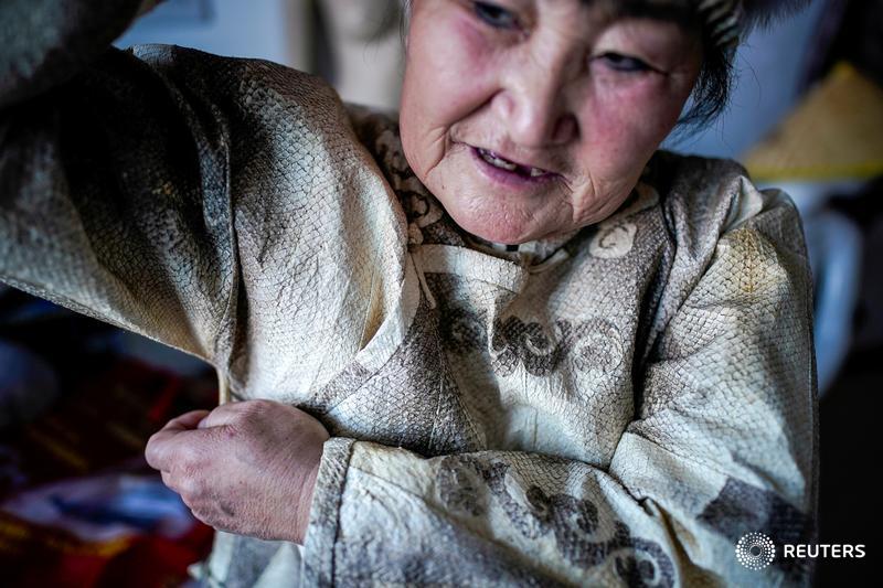 You Wenfeng, who belongs to China’s tiny Hezhen ethnic group, is one of ...