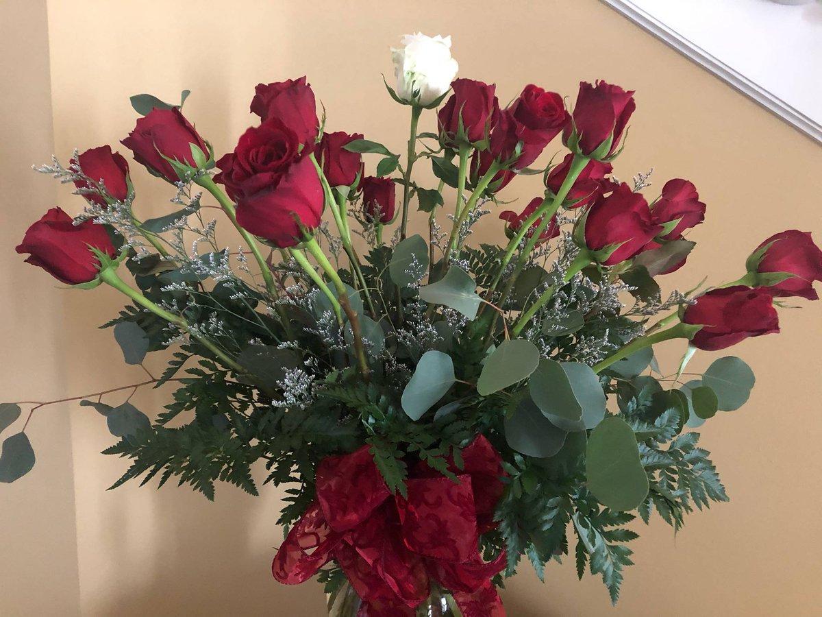 One White Rose In A Dozen Red Roses