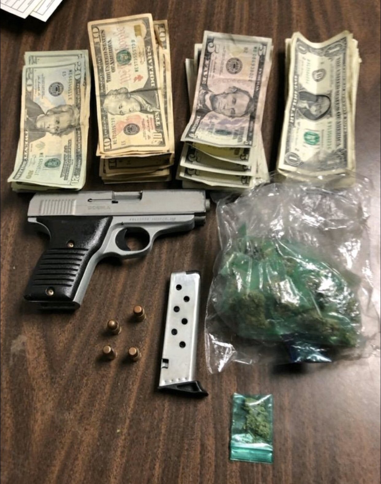 Money On Table With Gun