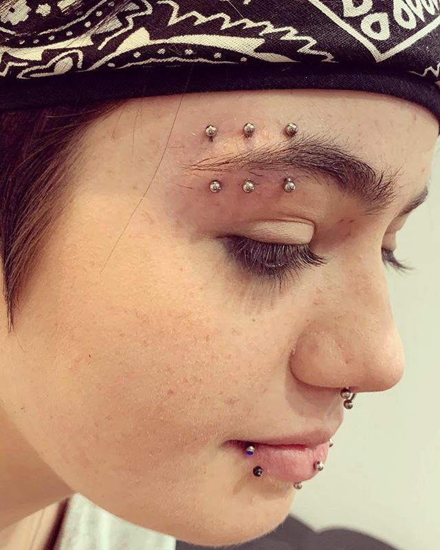 Double Eyebrow Piercings
