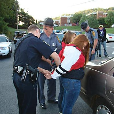 Woman Arrested Cuffed