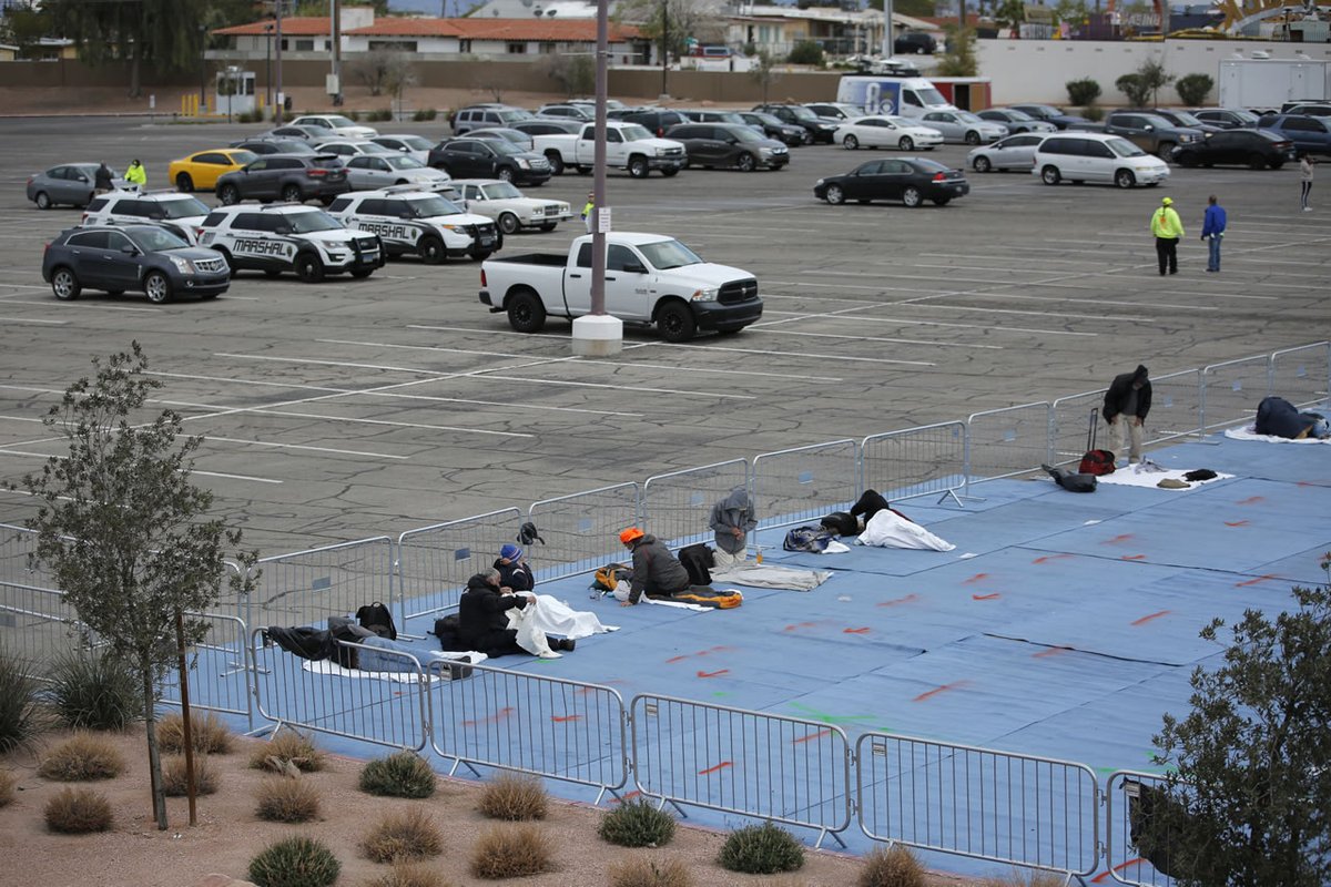 Jarring images show a crowd of homeless people sleeping in grids six ...