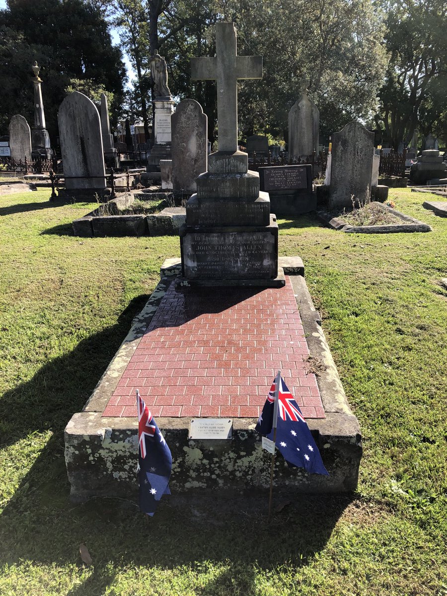 Australian flags in front of a military grave at Manly Cemetery ahead ...