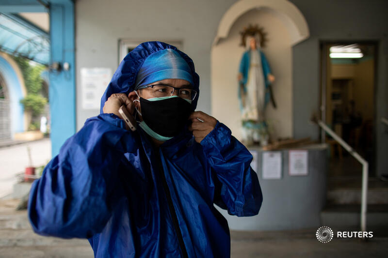 Meet Catholic priest Eduardo 'Ponpon' Vasquez. He has worn a hazmat ...
