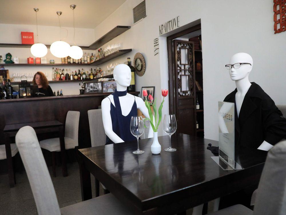 Dining dummies help cafe-goers keep a fashionable distance in Vilnius ...