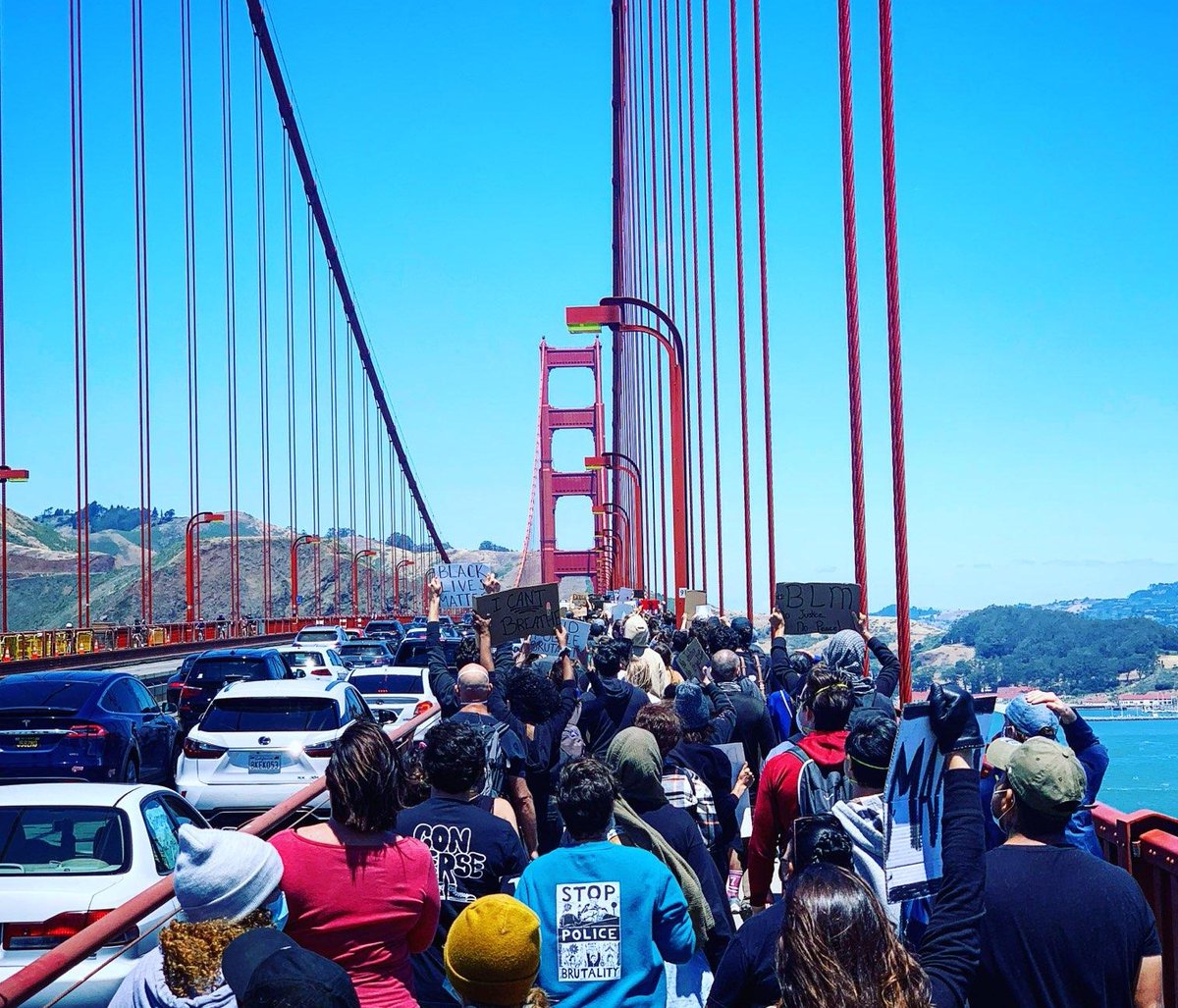 A sea of protestors is marching across San Francisco's Golden Gate ...
