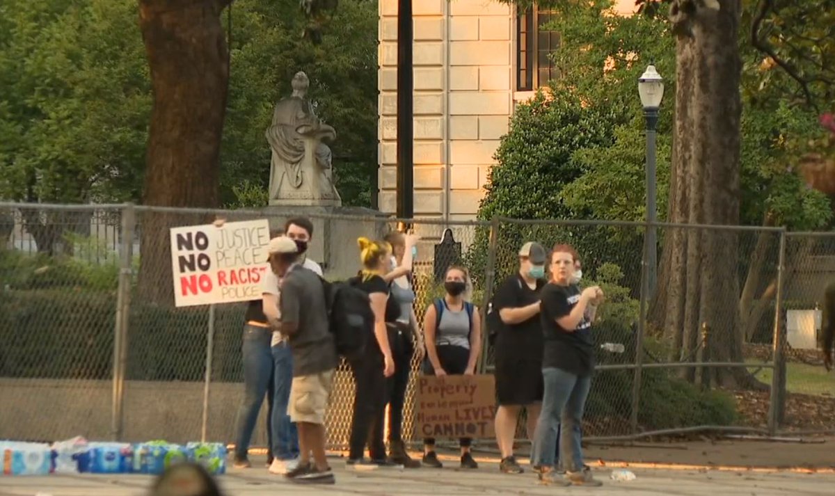 HAPPENING NOW: A few protesters are remaining as the 7 pm curfew passes ...