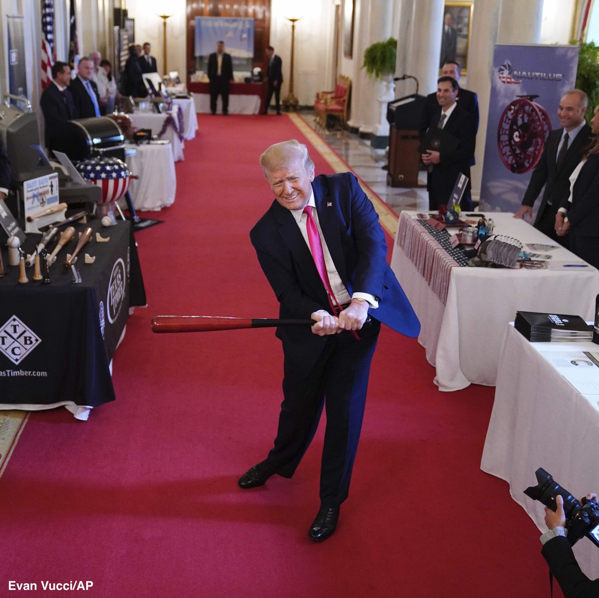 Pres. Trump swings a baseball bat during the "Spirit of America ...