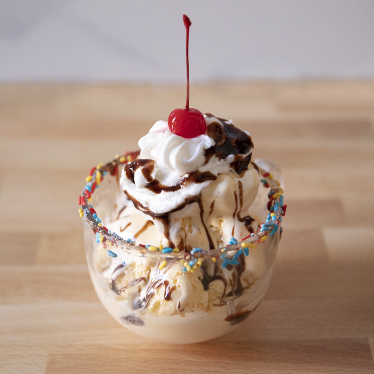 Vanilla Ice Cream With Chocolate Syrup And Whipped Cream