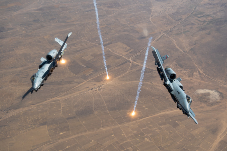 Two U.S. Air Force A-10 Thunderbolt IIs release countermeasure flares ...