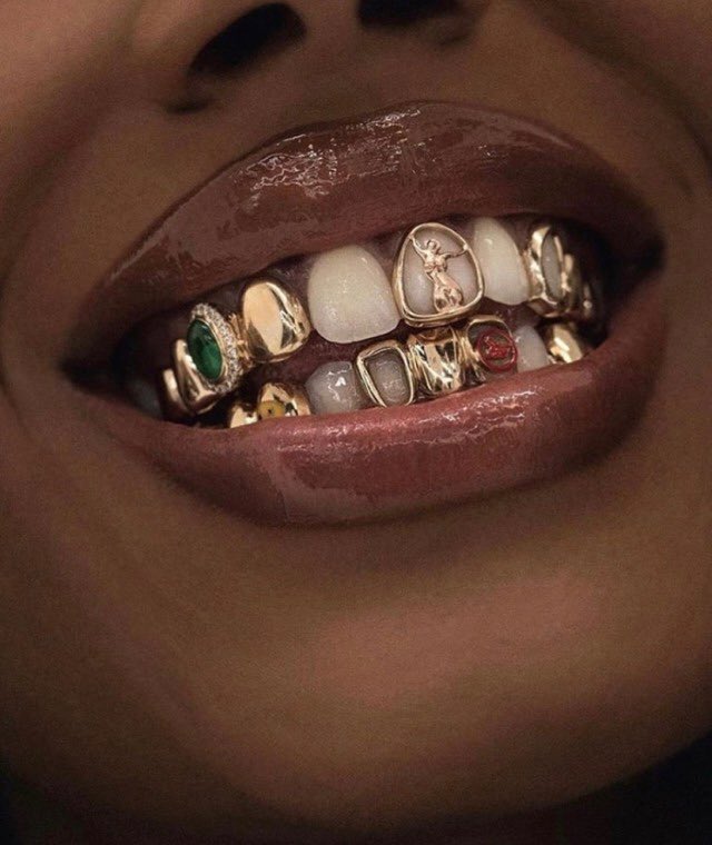 Women Black With Gold Teeth