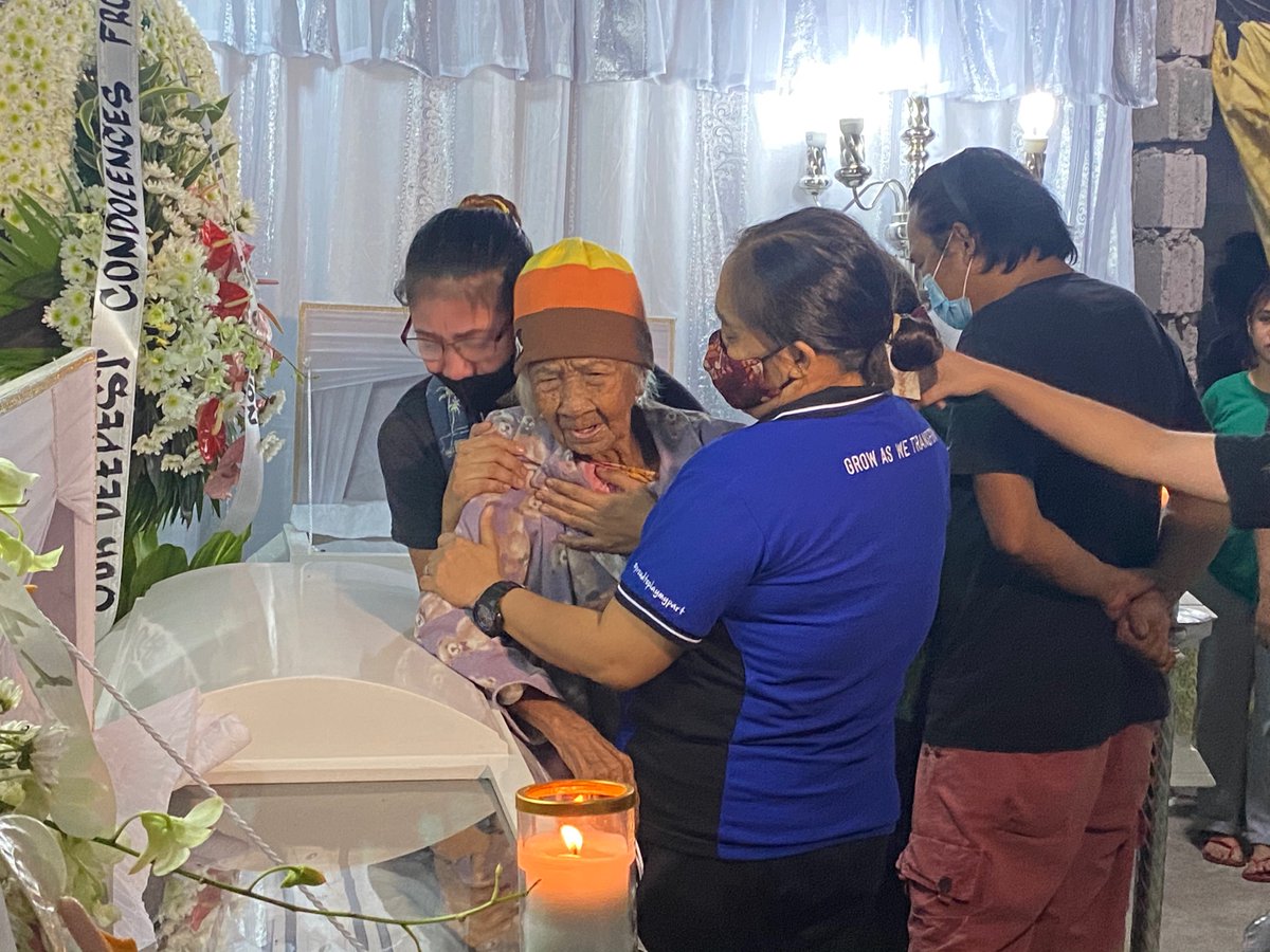 94-year-old Carmen Rufino weeps upon seeing the remains of her daughter ...