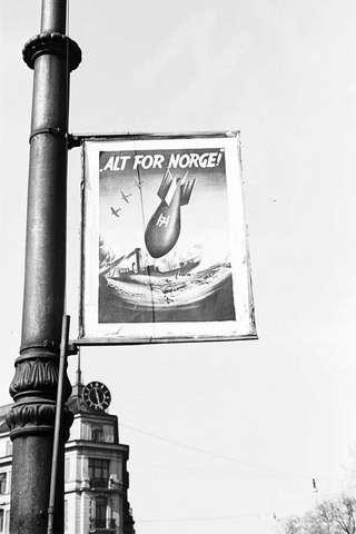 Two FARC soldiers standing next to an anti-US billboard showing a ...