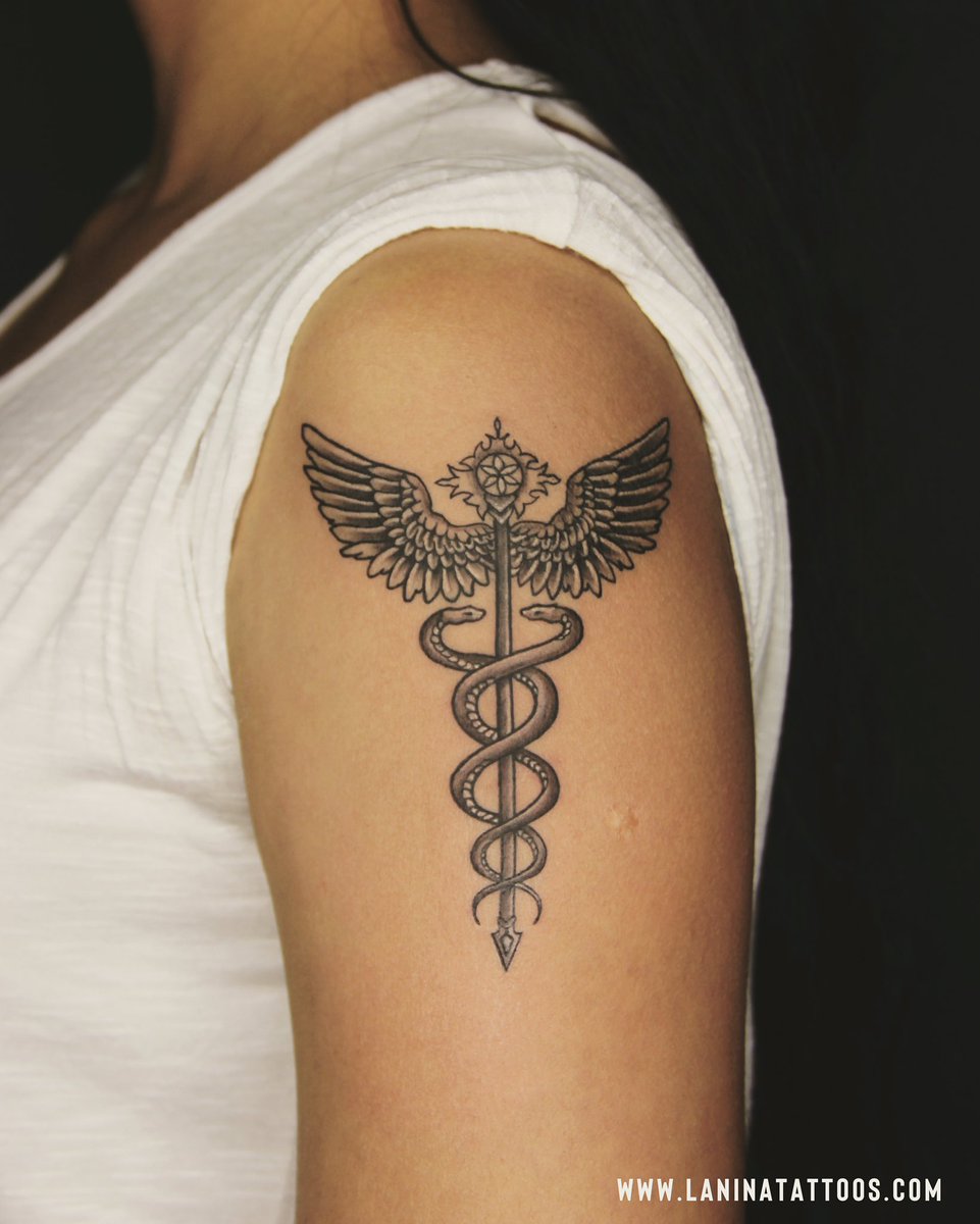 Medical Symbol Back Tattoo