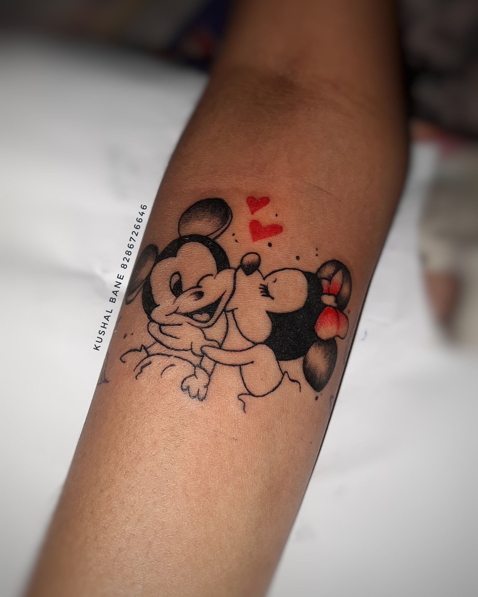 Minnie Mouse And Mickey Mouse Kissing Tattoo