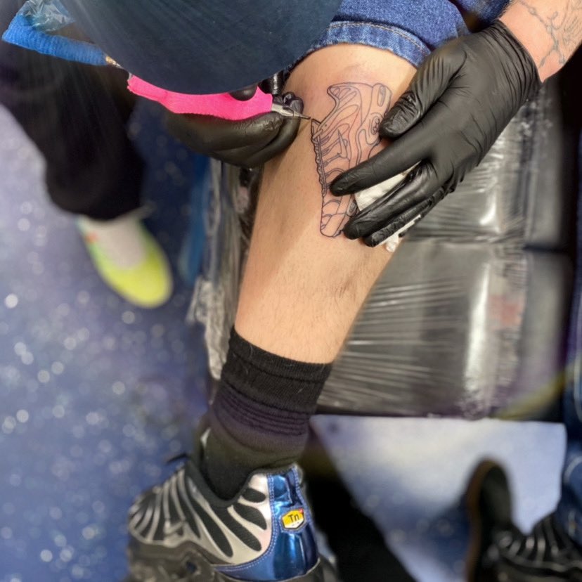 Nike Swoosh Tattoo On Arm