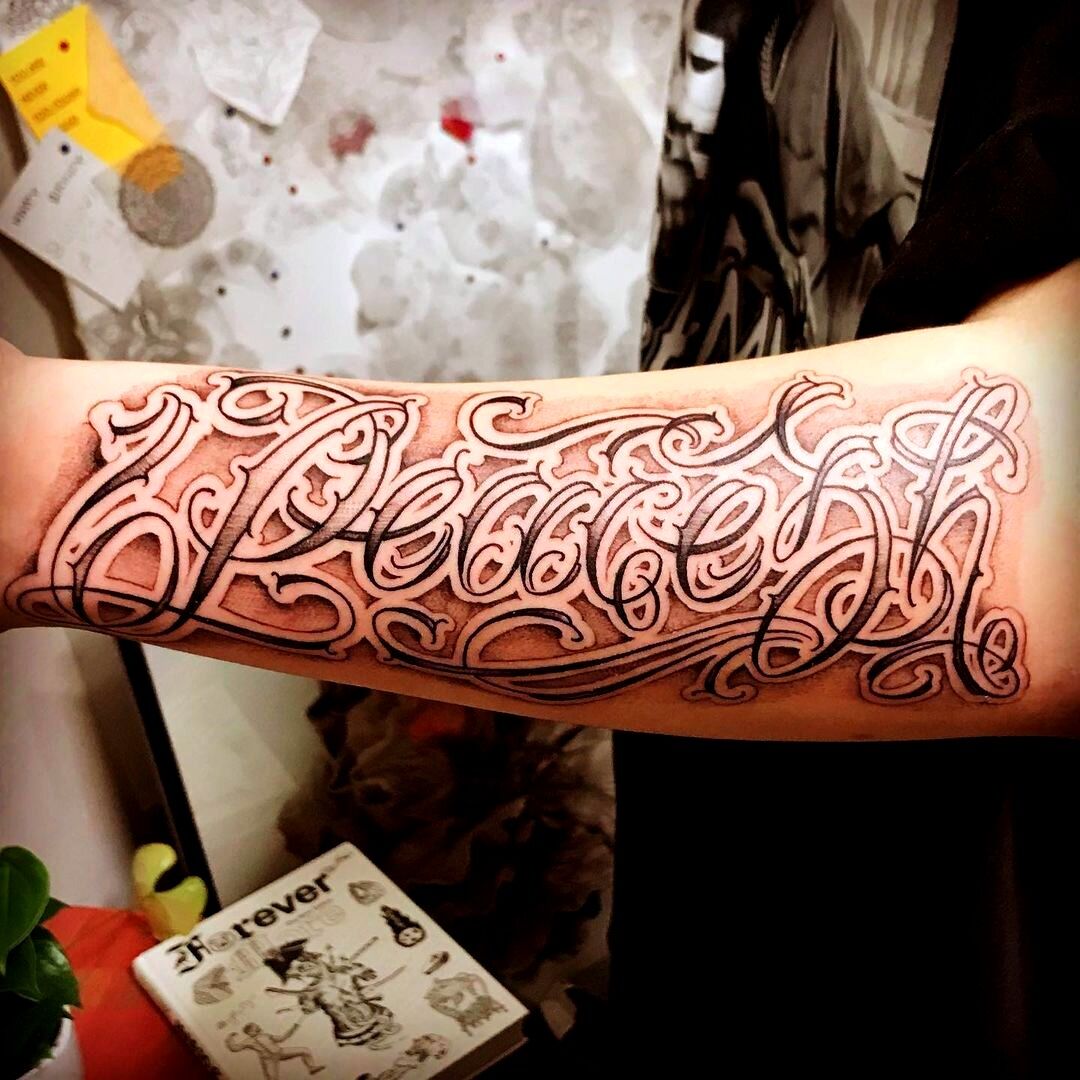 Welsh Script Tattoos