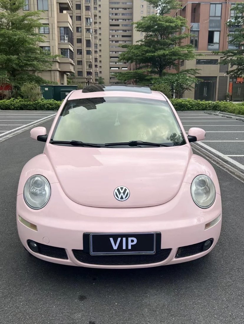 Pink Volkswagen Beetle Convertible With Eyelashes