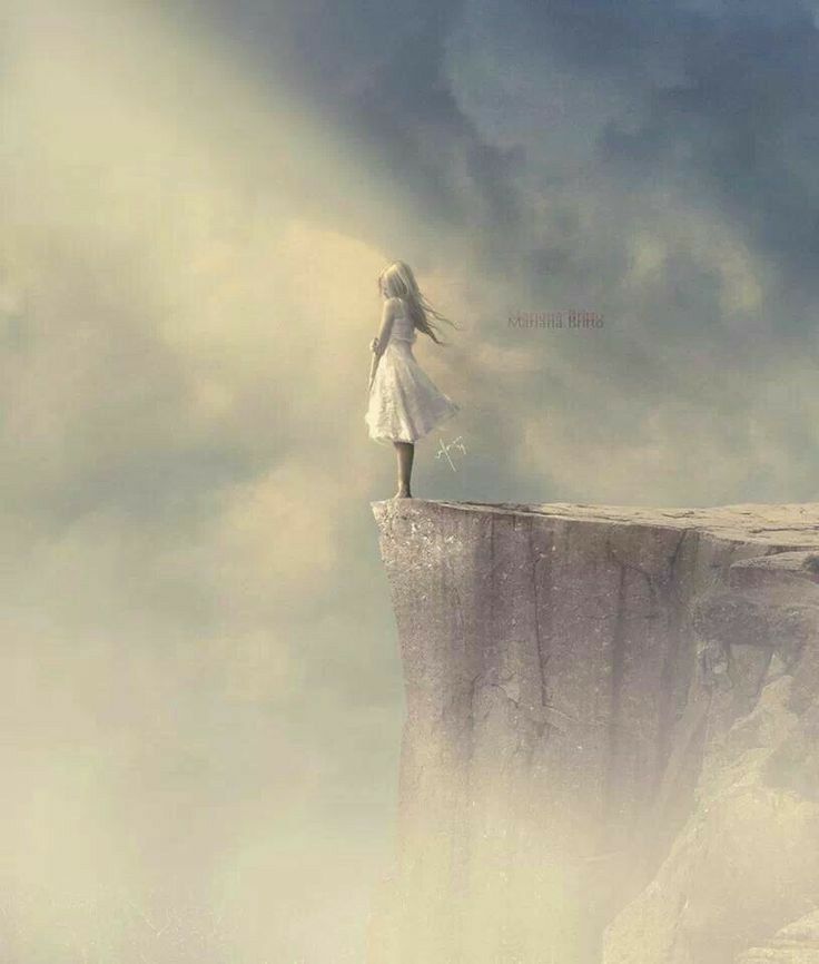 Sad Girl Standing On Cliff