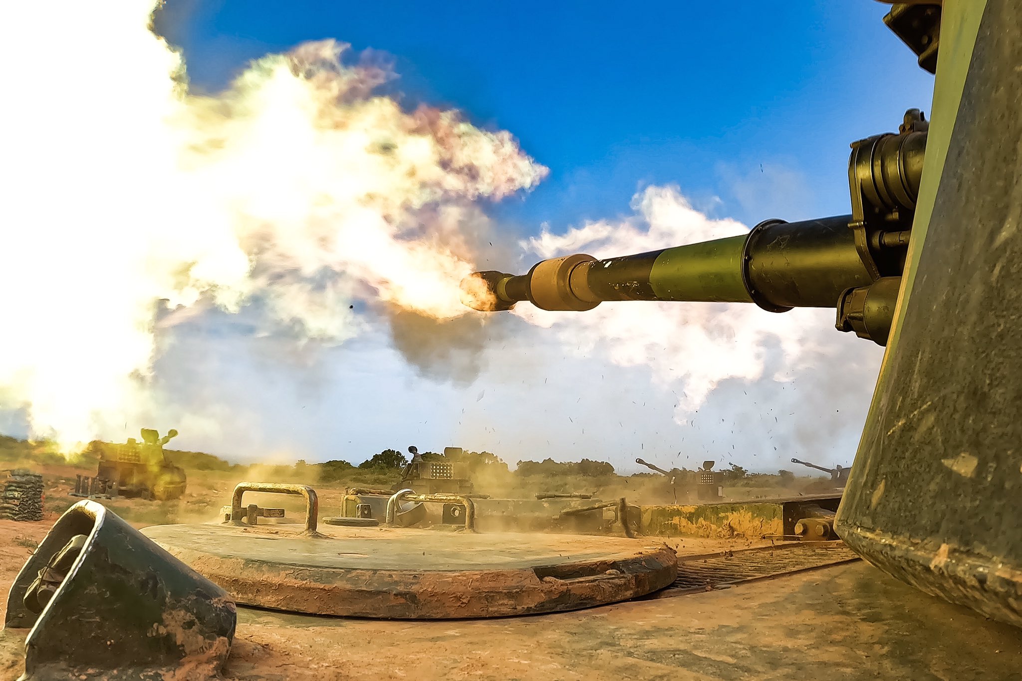 Line Of Artillery Guns Firing