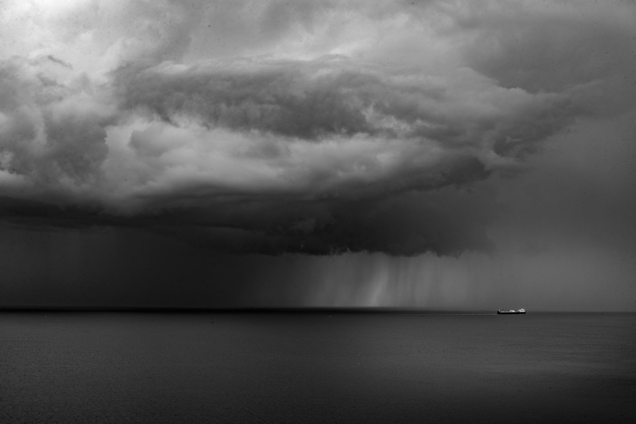 Storm Clouds Gathering Over Water