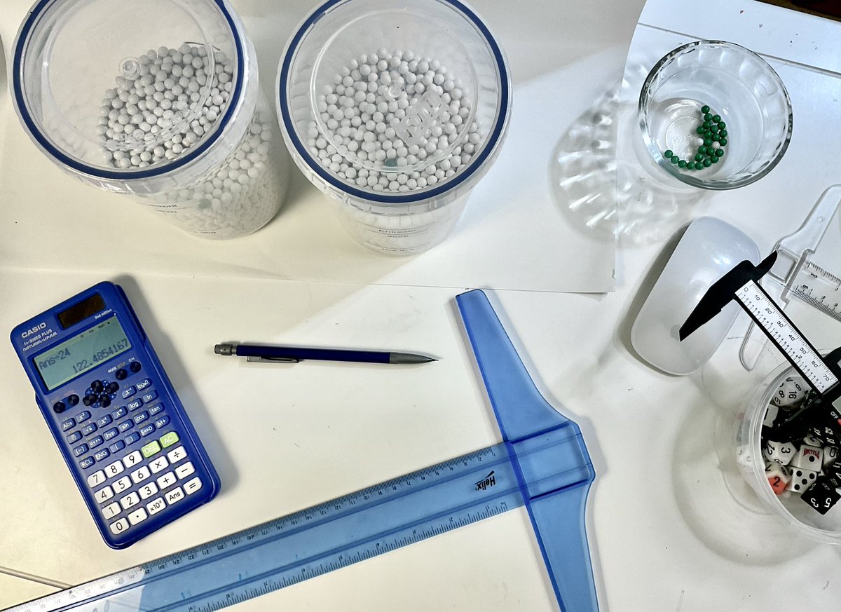 The container on the left has 3,820 balls in it. 3819 white and one ...