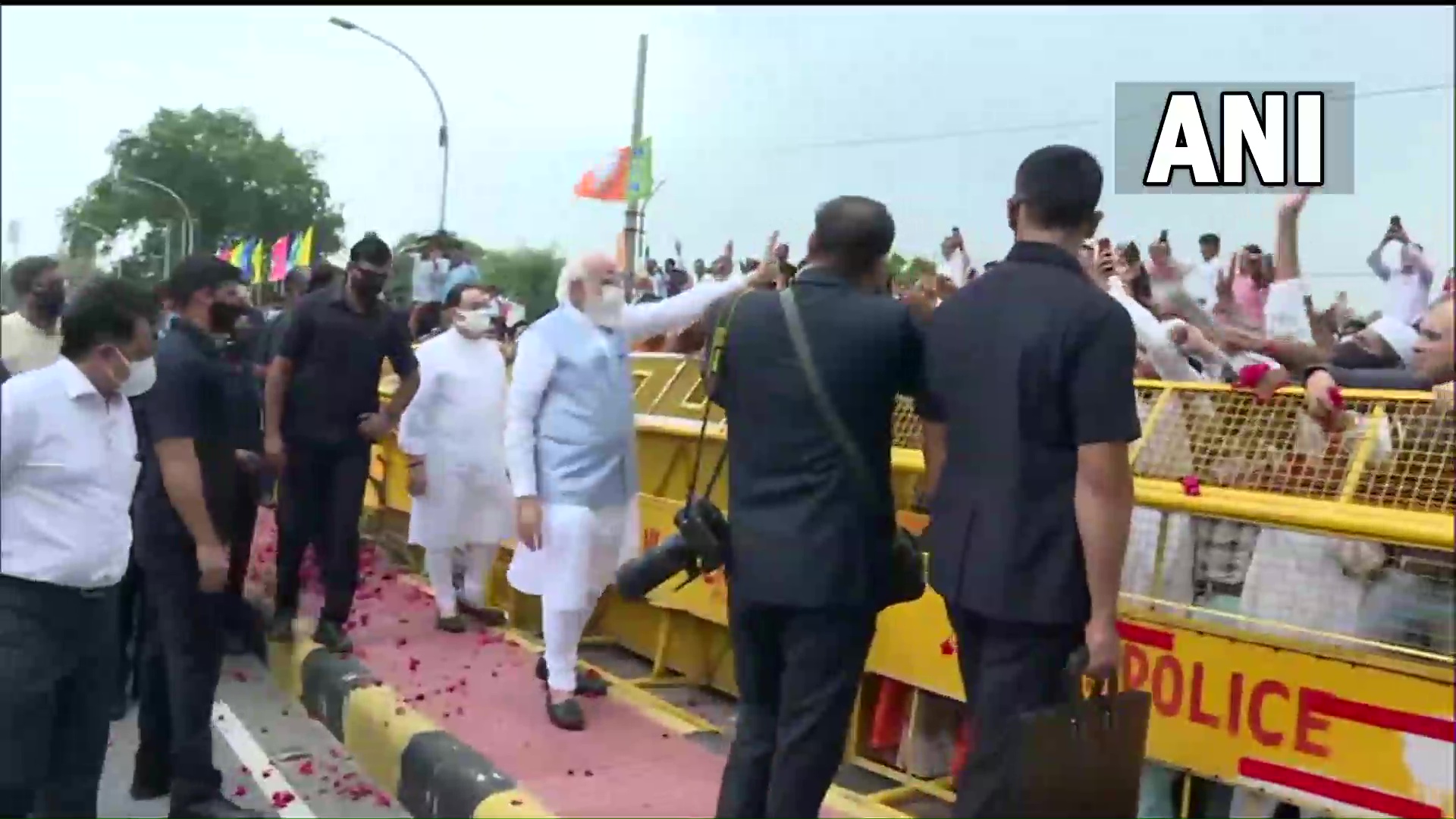ANI on Twitter: "Delhi | PM Modi greets supporters waiting near the Palam Technical Airport ...