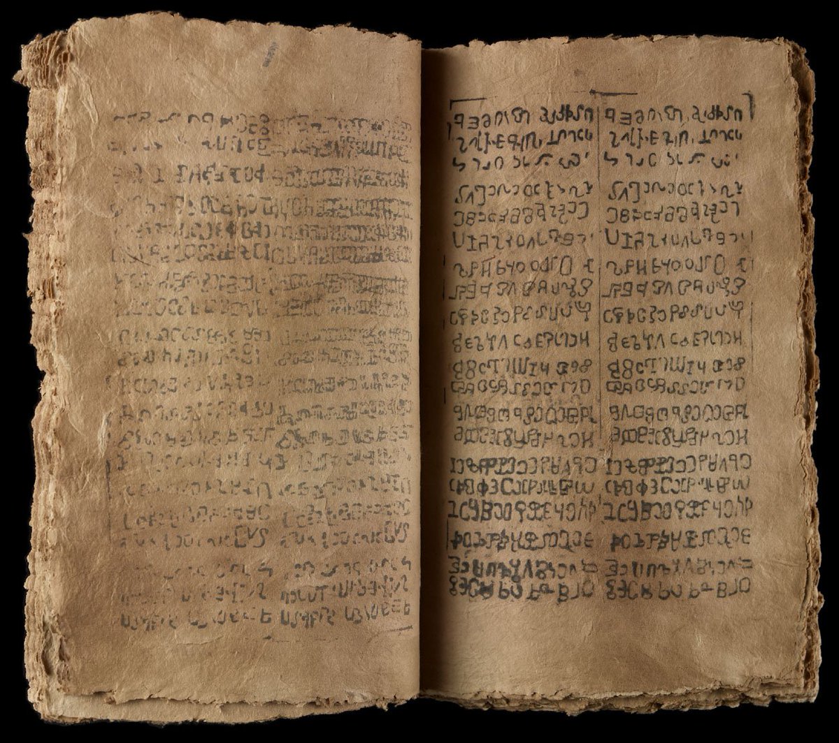 This seemingly antique manuscript, written in a script that resembles ...