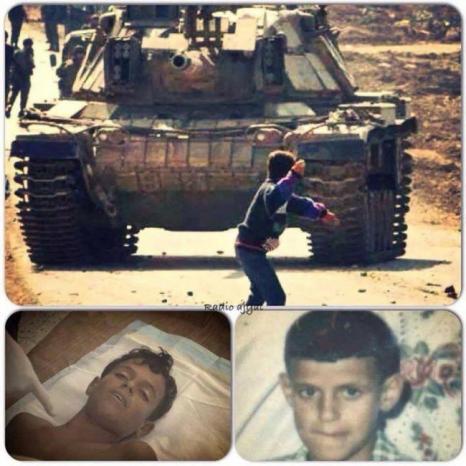 Palestinian Boy Throwing Rock At Tank