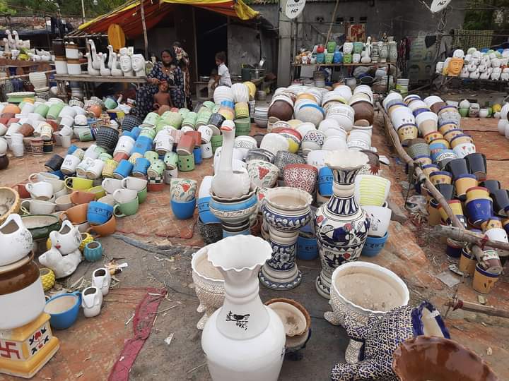 These ceramic (local) flower pots are openly being displayed on road ...