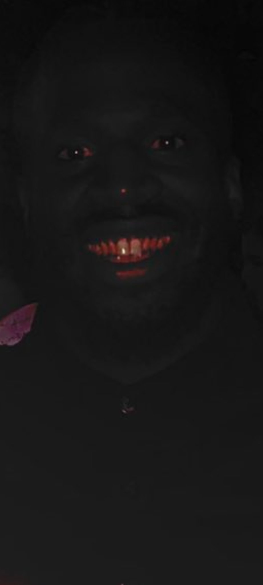 Black Man Smiling In The Dark