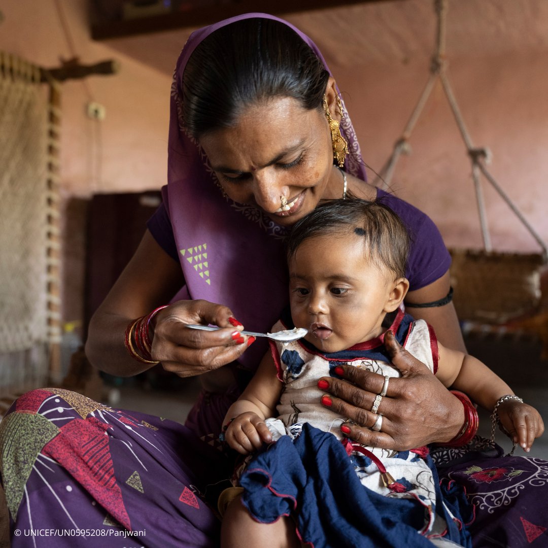 Poor Indian Mother With Baby