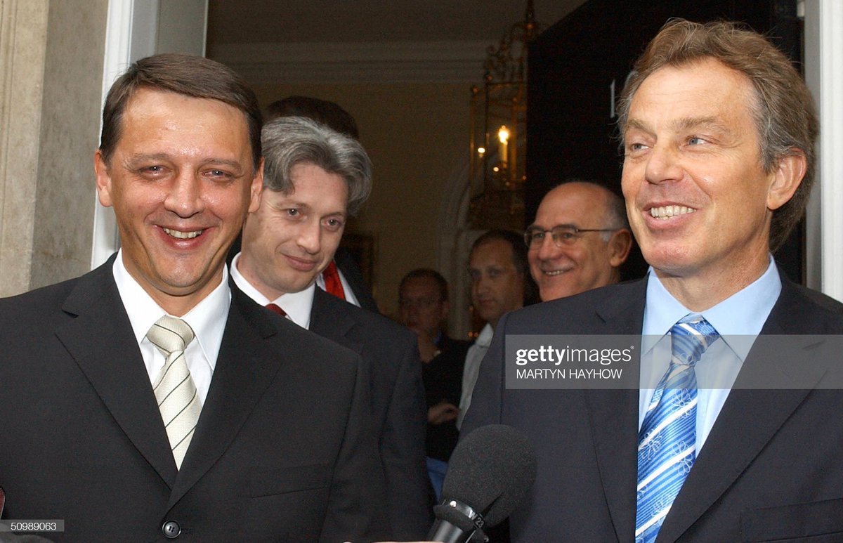 "British Prime Minister Tony Blair (R) smiles with his Slovenian counterpart Anton Rop 23 June ...