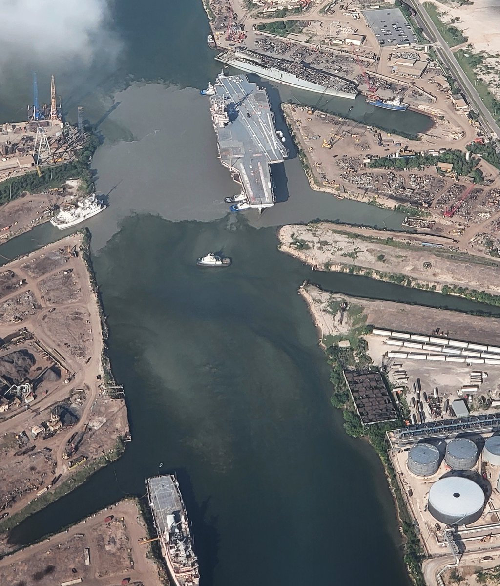 Across the Brownsville Ship Channel is the white-hulled HAYES T-AG195 ...