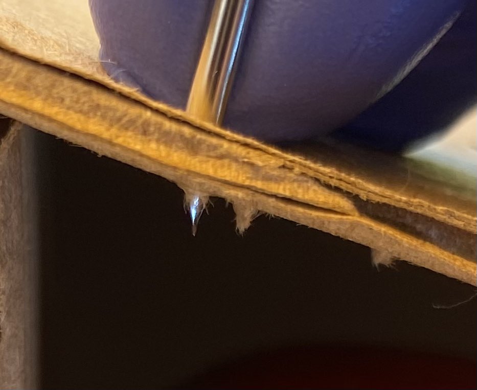 Slow-motion video of a Veress needle going through a cardboard box. A ...