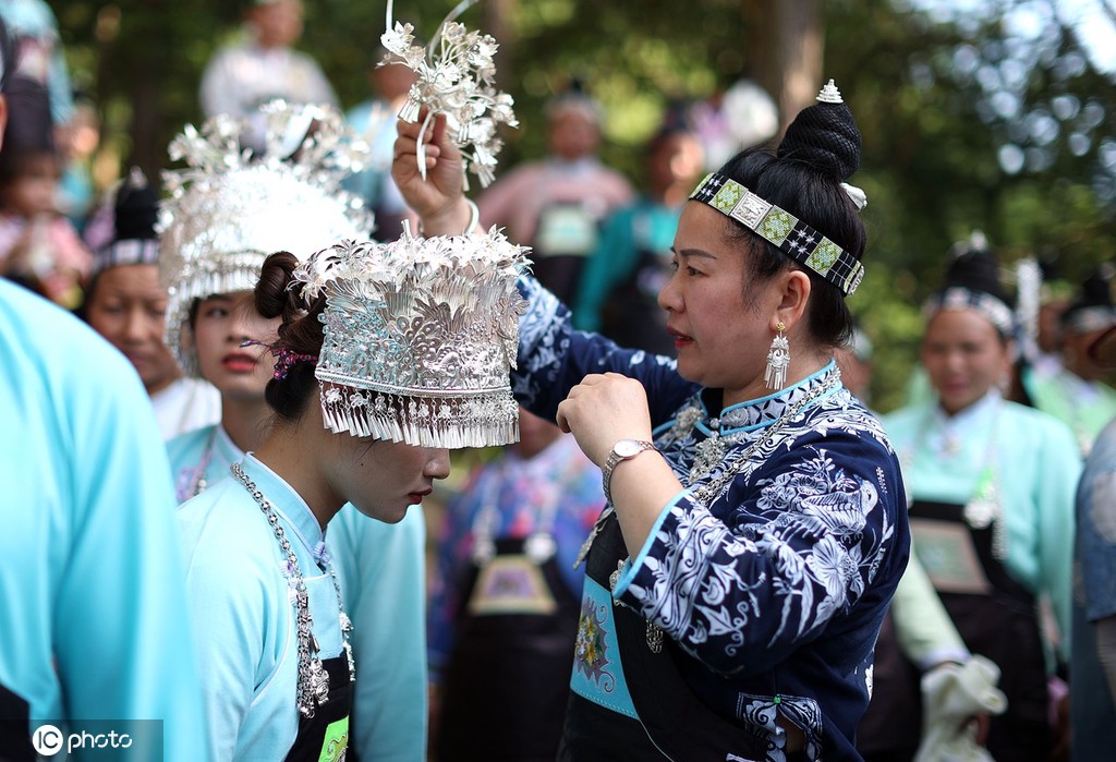 Miao villagers in Guizhou province dress in traditional costumes, and ...