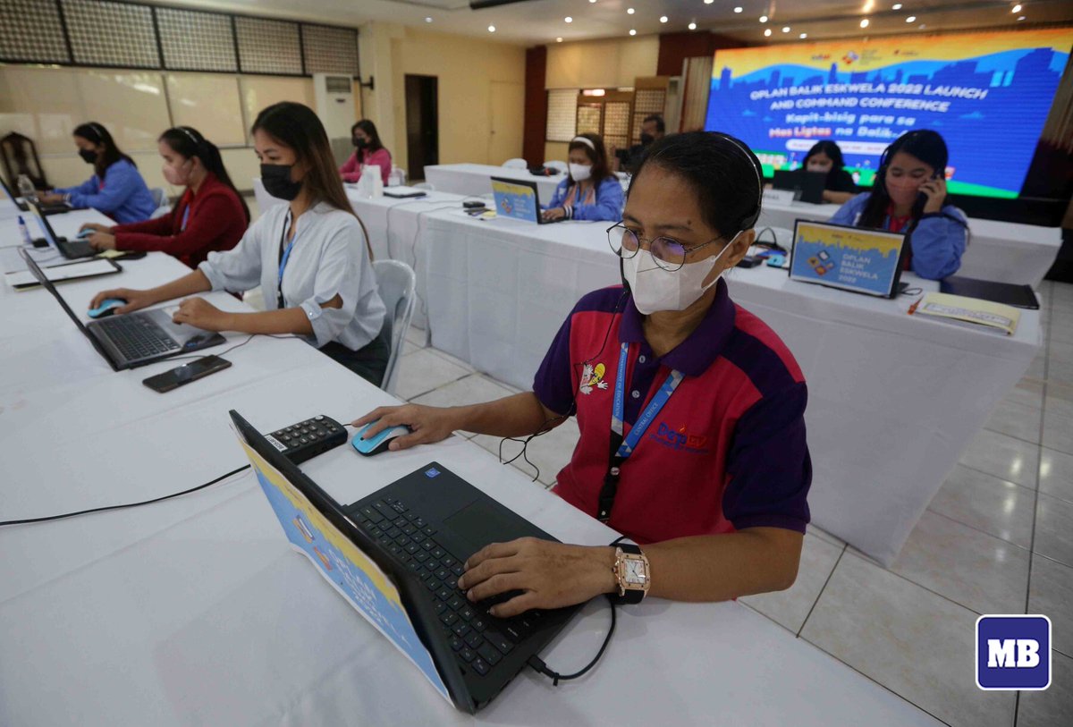 Personnel from DepEd answer questions from callers at the newly ...