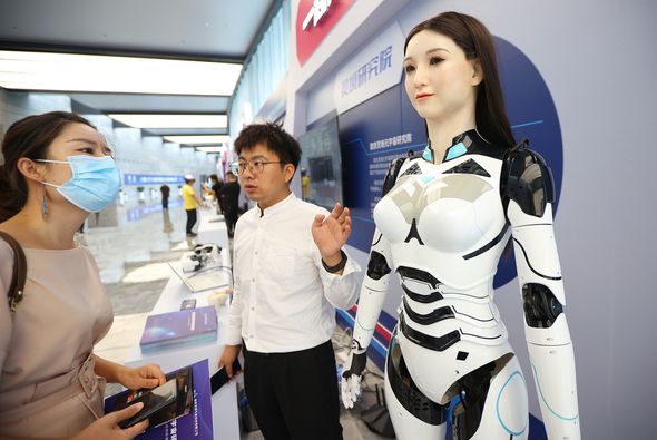 People's Daily, China on Twitter: "A life-like robot girl able to interact with humans draws the ...